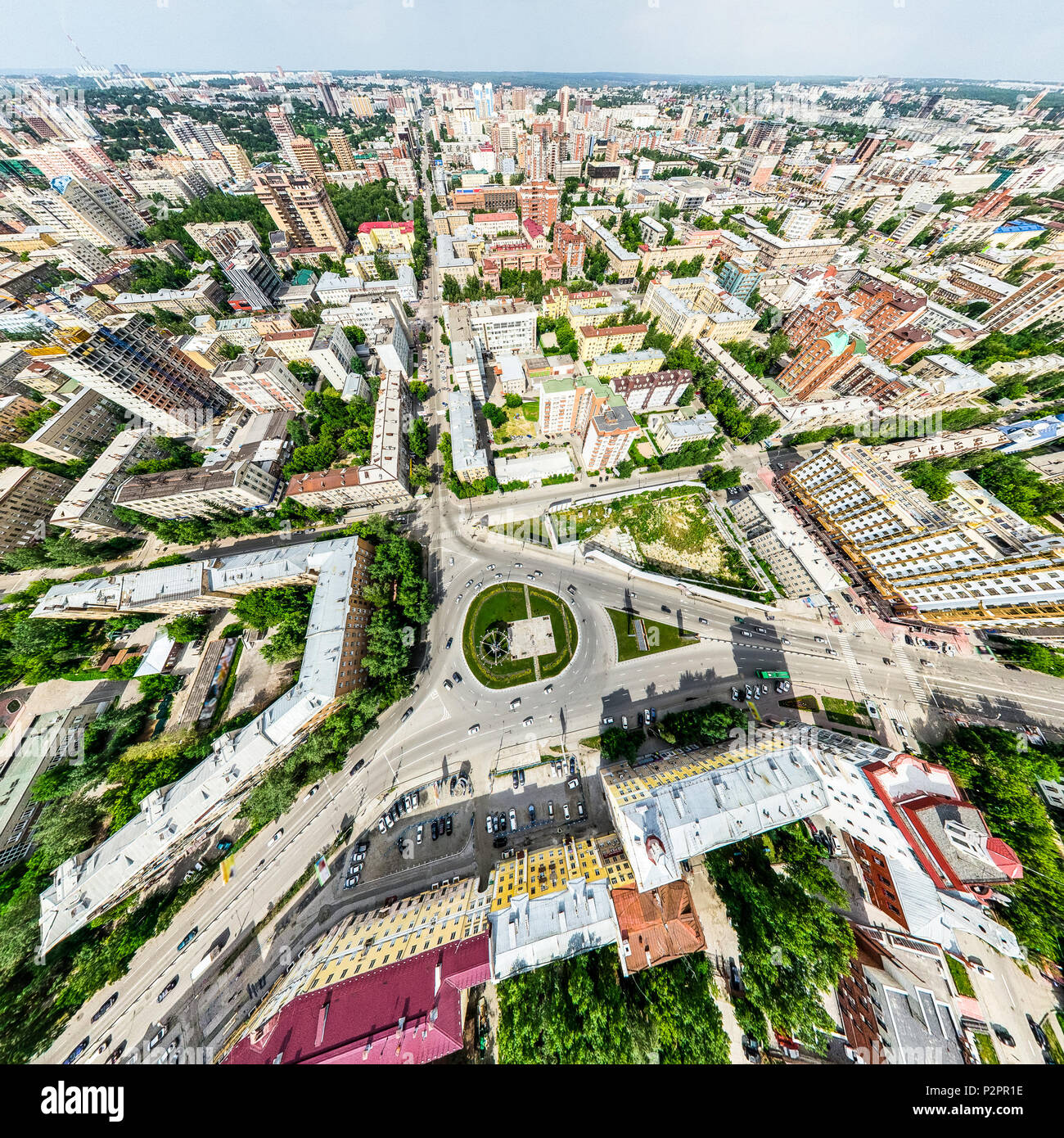 Aerial city view with crossroads and roads, houses, buildings, parks ...