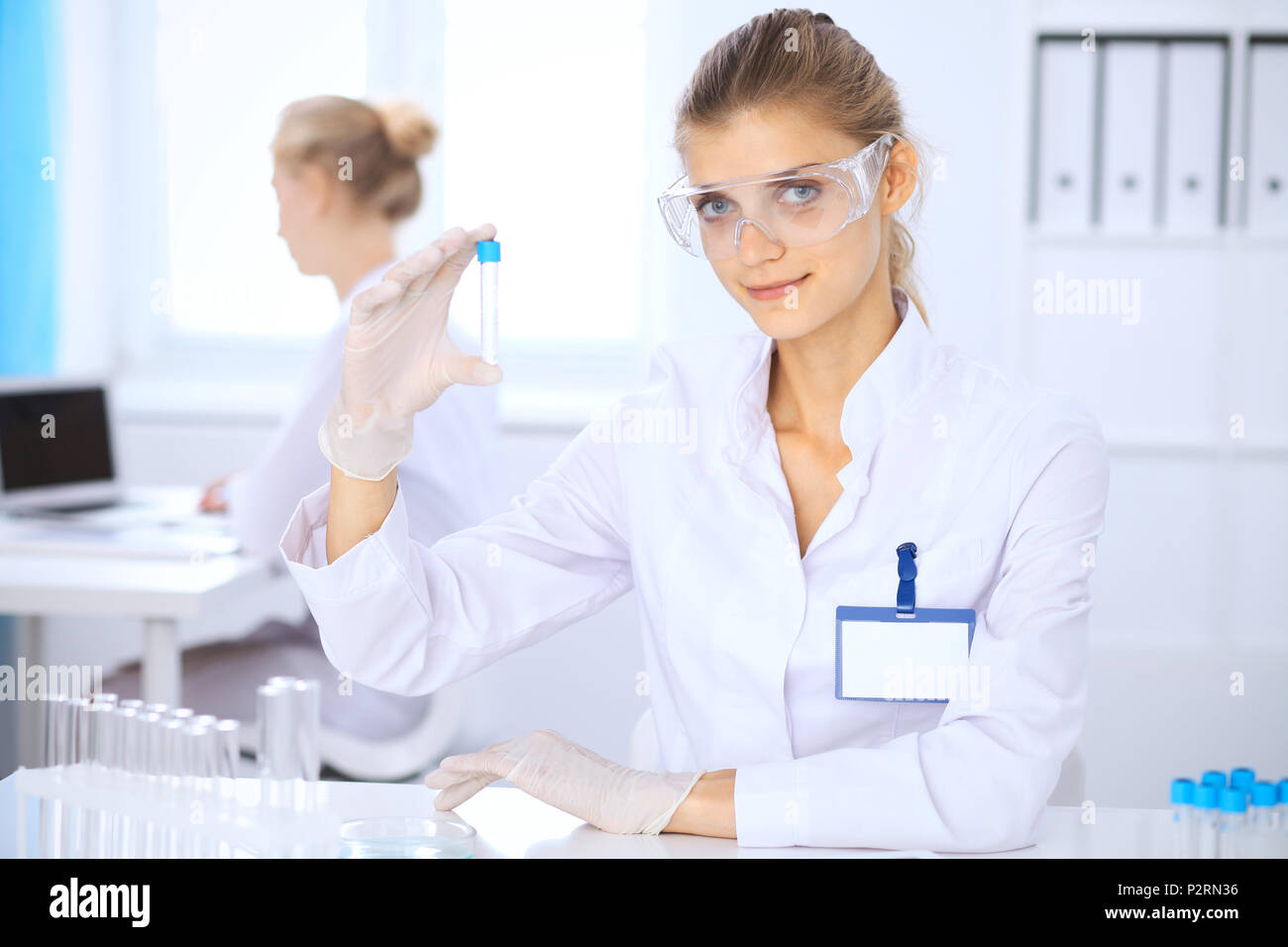 Female scientific researcher or blood test assistant in laboratory ...