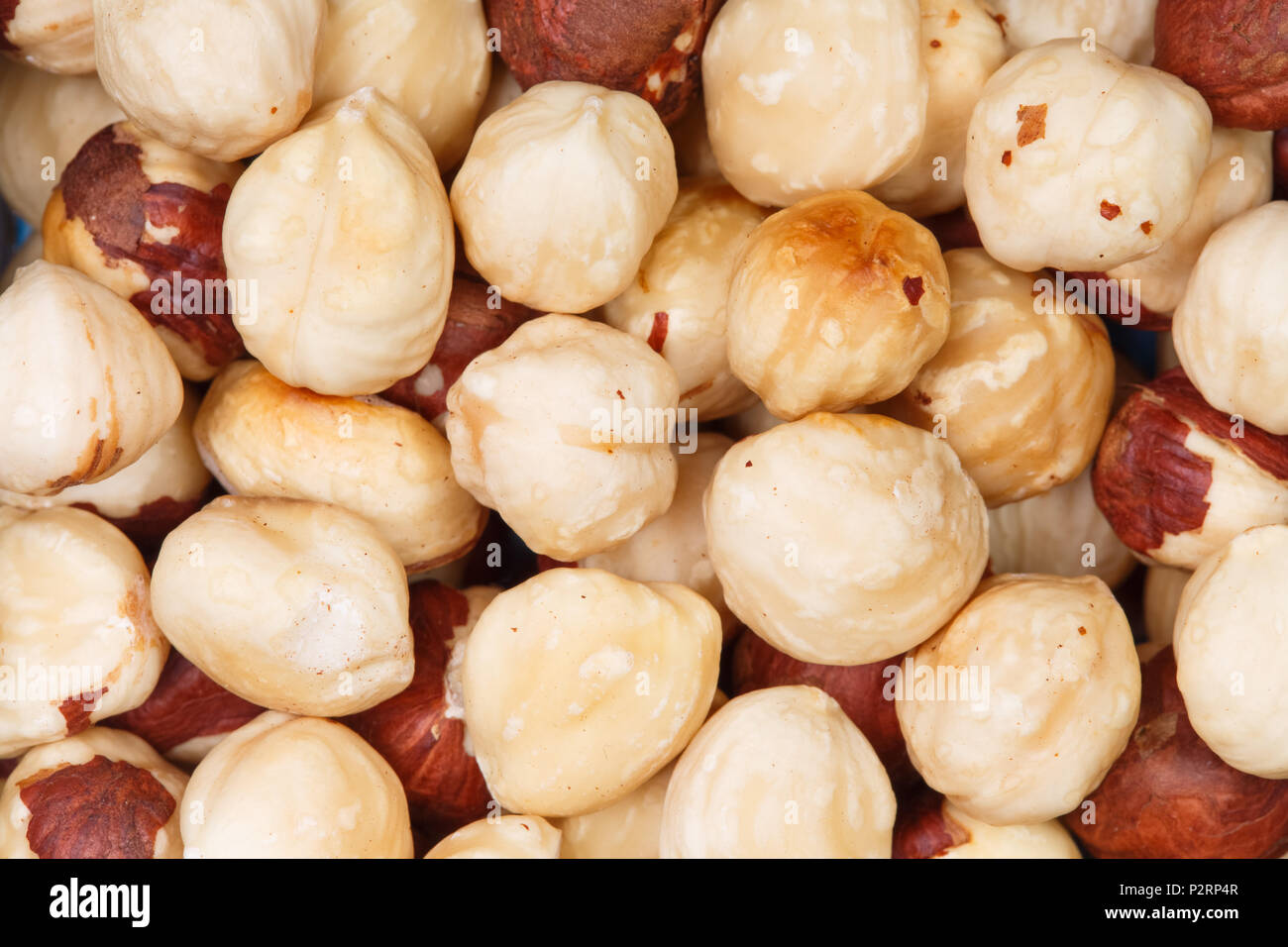 Hazelnuts background on macro Stock Photo - Alamy