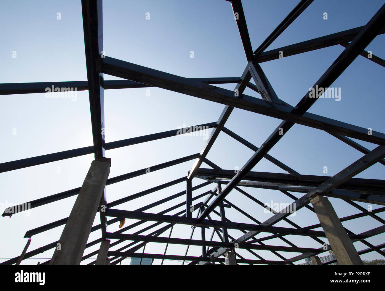 Steel structure with blue sky background Stock Photo - Alamy