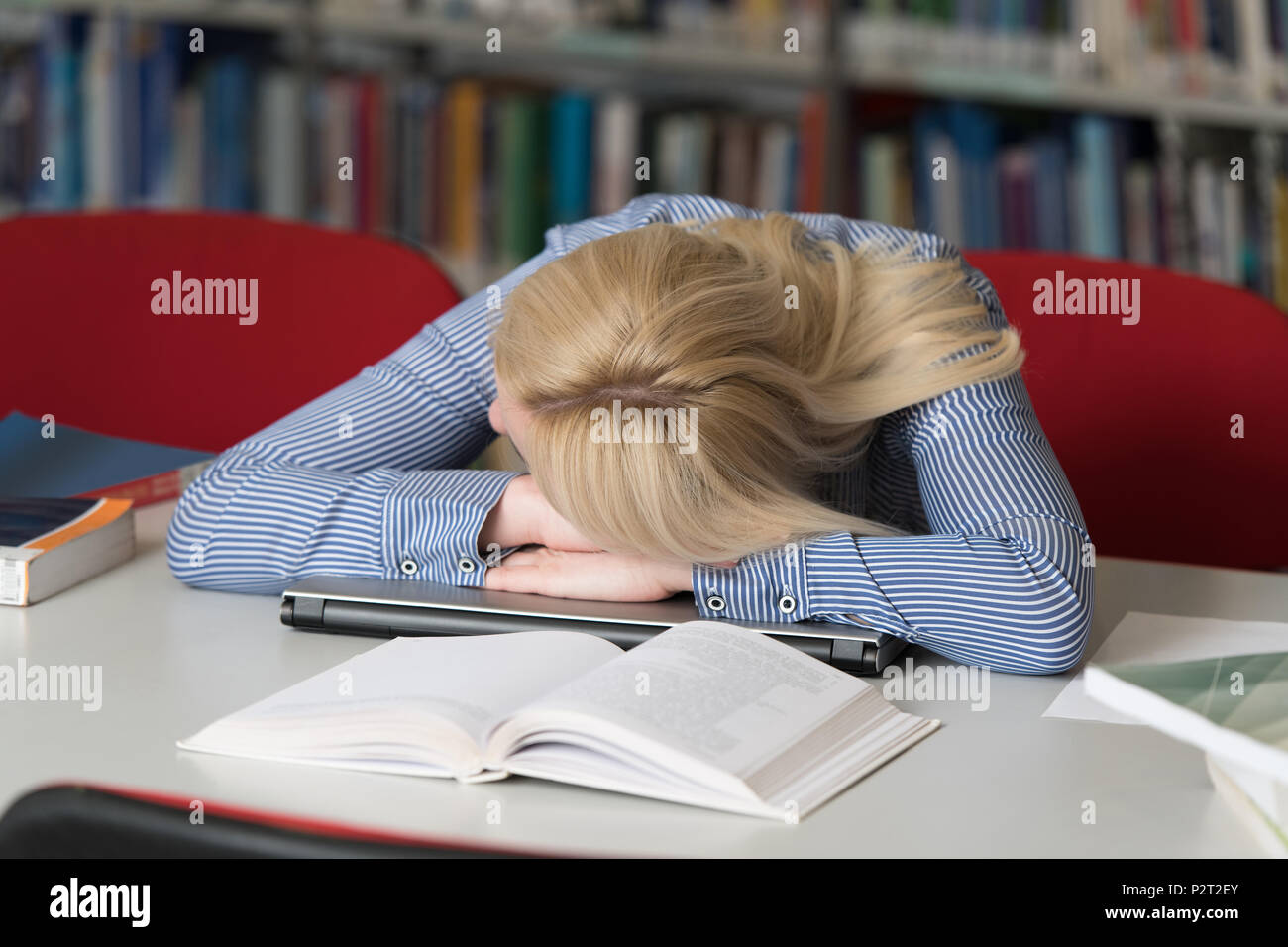 In the Library Pretty Female Student With Books Sleeping in a High ...