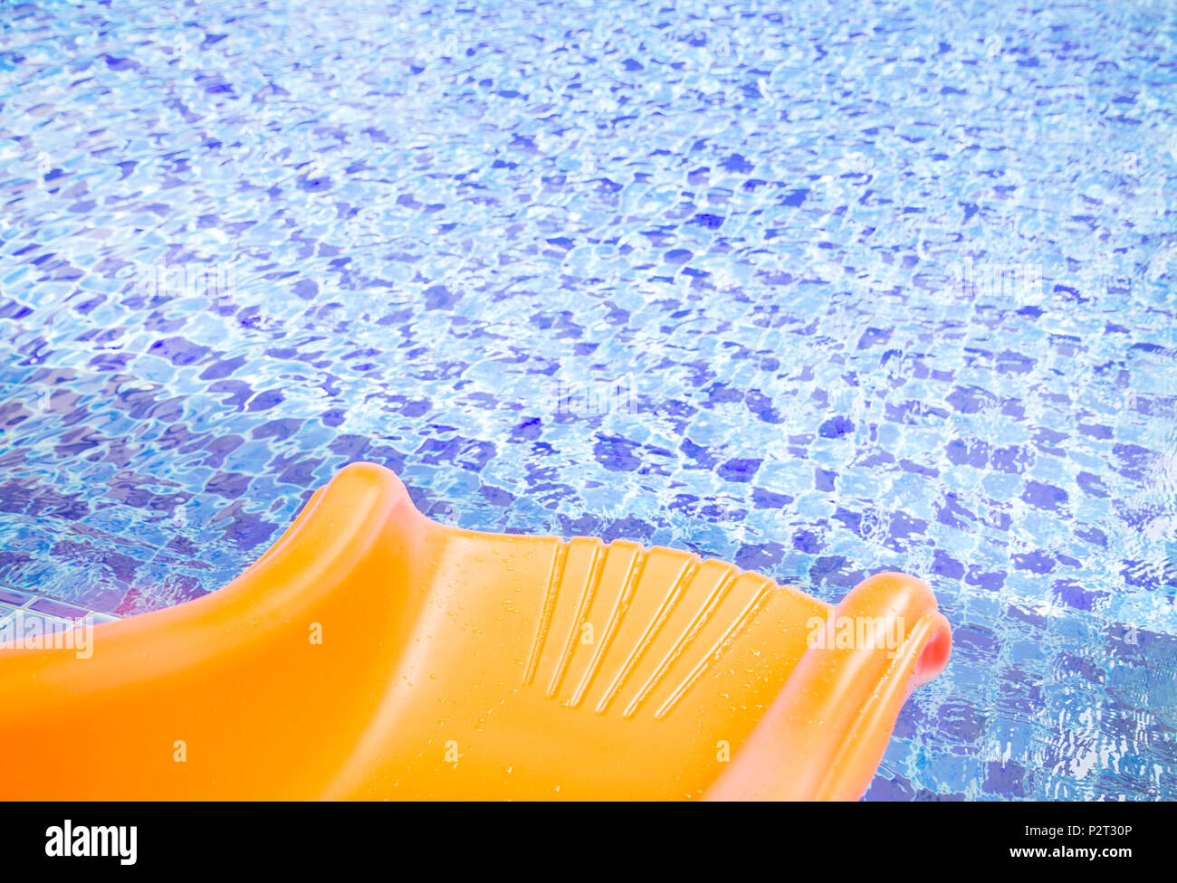 Orange pool slider Stock Photo - Alamy