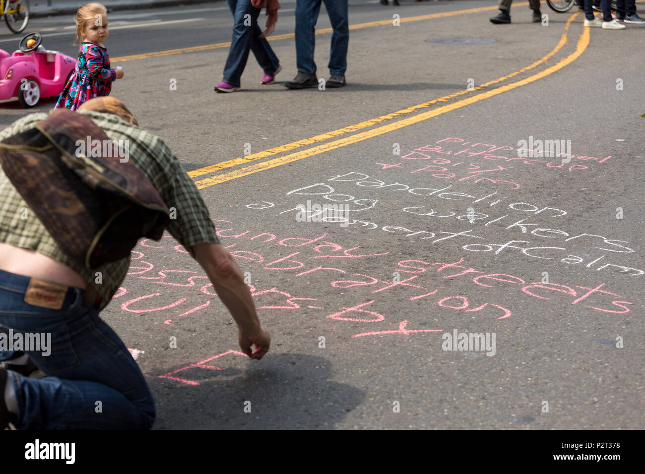 Man writing poem on a road. Sunday Streets, Valencia St., Mission, Aug ...