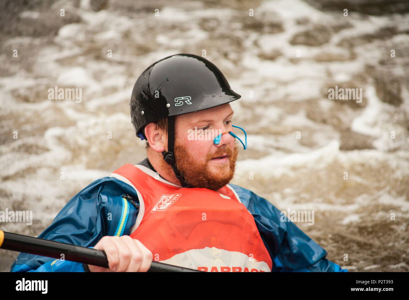 A man in a canoe at the Tees Barrage International White Water Centre ...