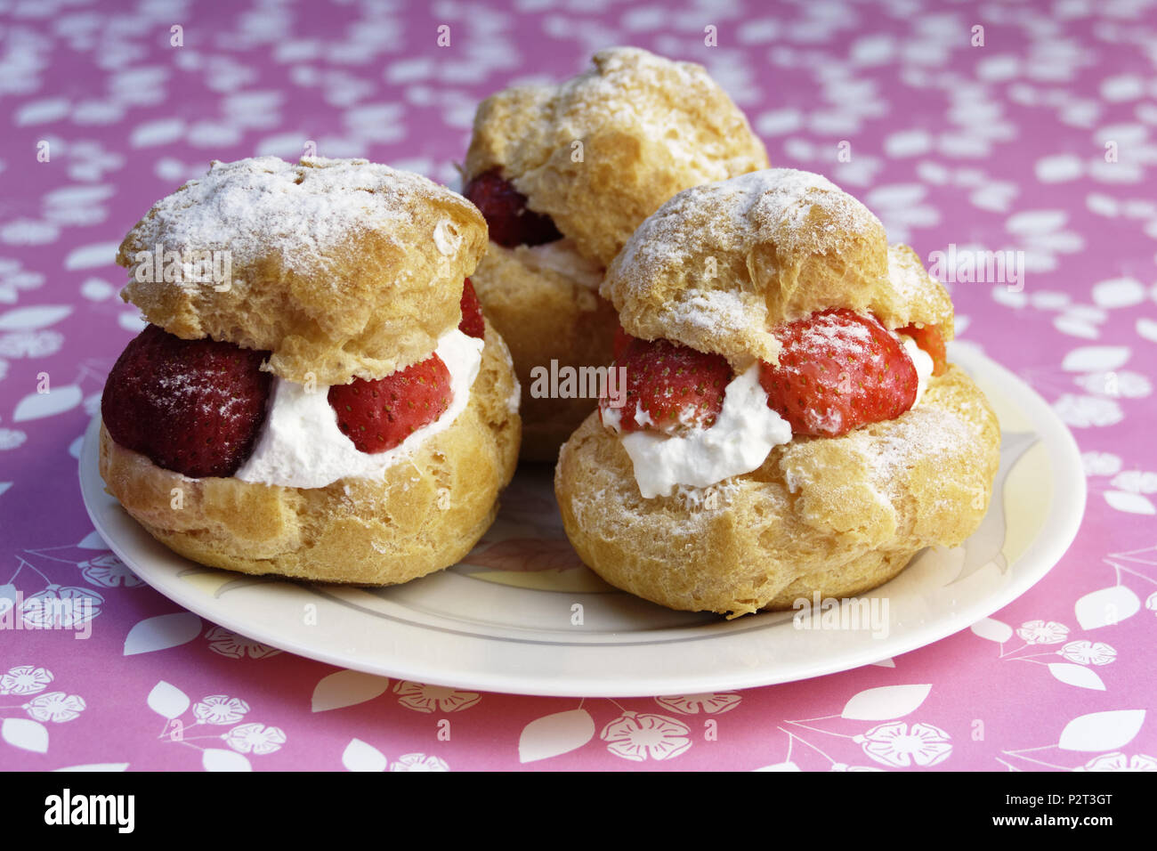 Cream puffs with strawberries Stock Photo - Alamy
