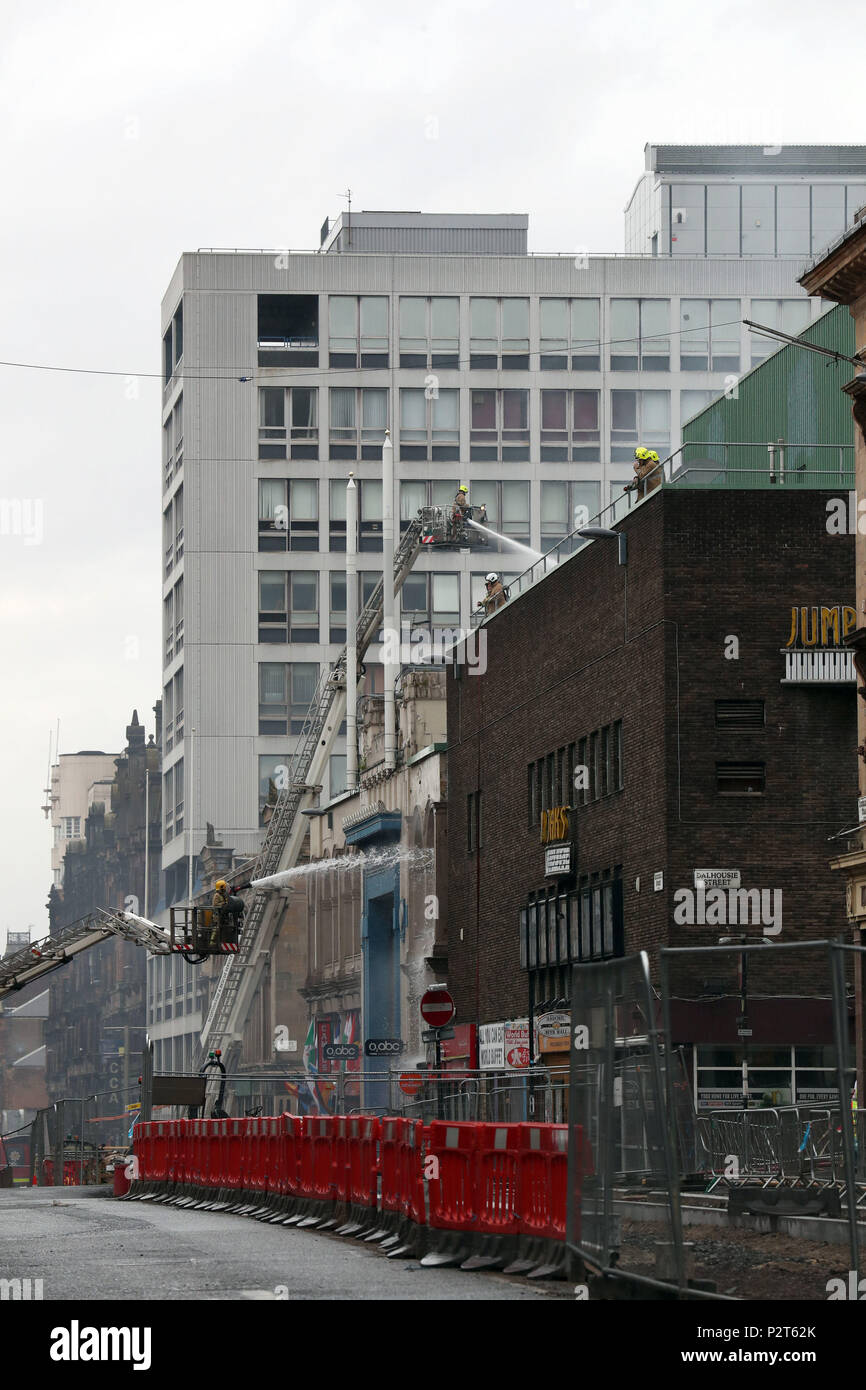 Firefighters douse the O2 ABC close to the historic Mackintosh Building ...