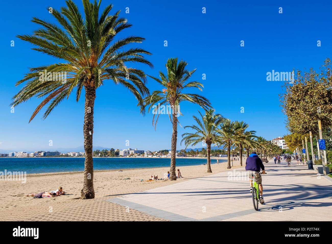 Spain, Catalonia, Roses searesort, the waterfront promenade lined with ...