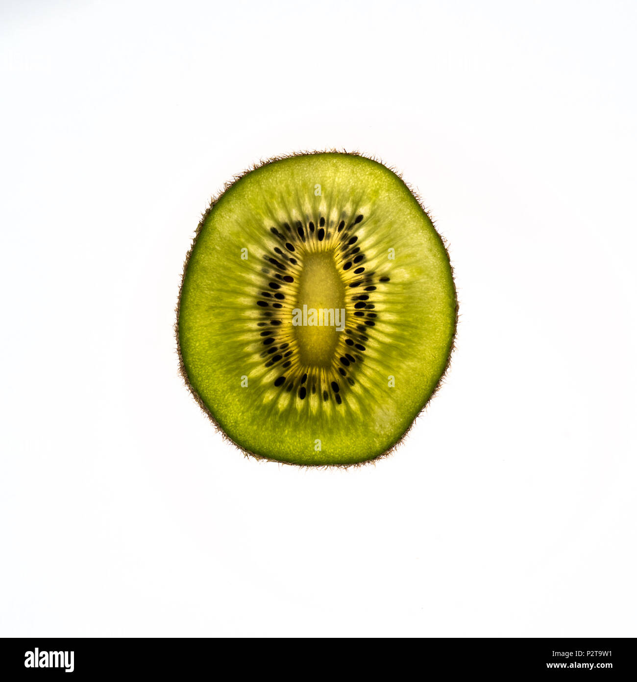 kiwi slice lit from the back Stock Photo - Alamy