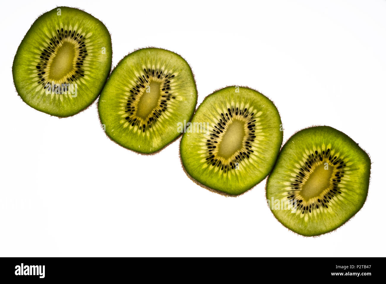 kiwi slices lit from the back Stock Photo - Alamy