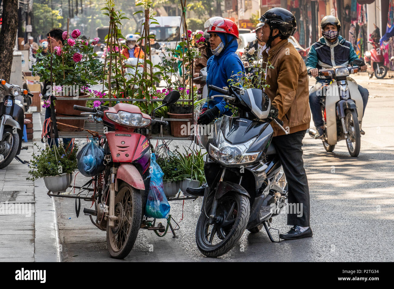 Vendors one foot,motorcyce and cycle in Hanoi Vietnam Stock Photo - Alamy