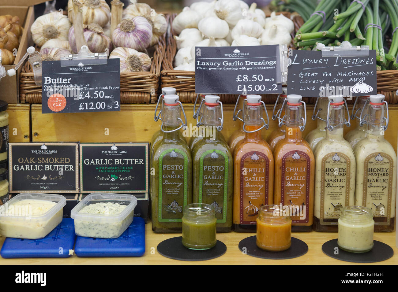 Garlic butters and garlic dressings on a market stall Stock Photo - Alamy