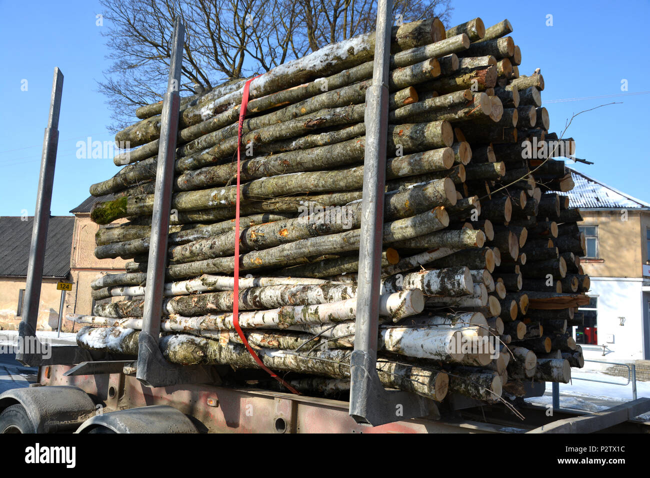 Truck transporting timber wood stack on road Stock Photo - Alamy