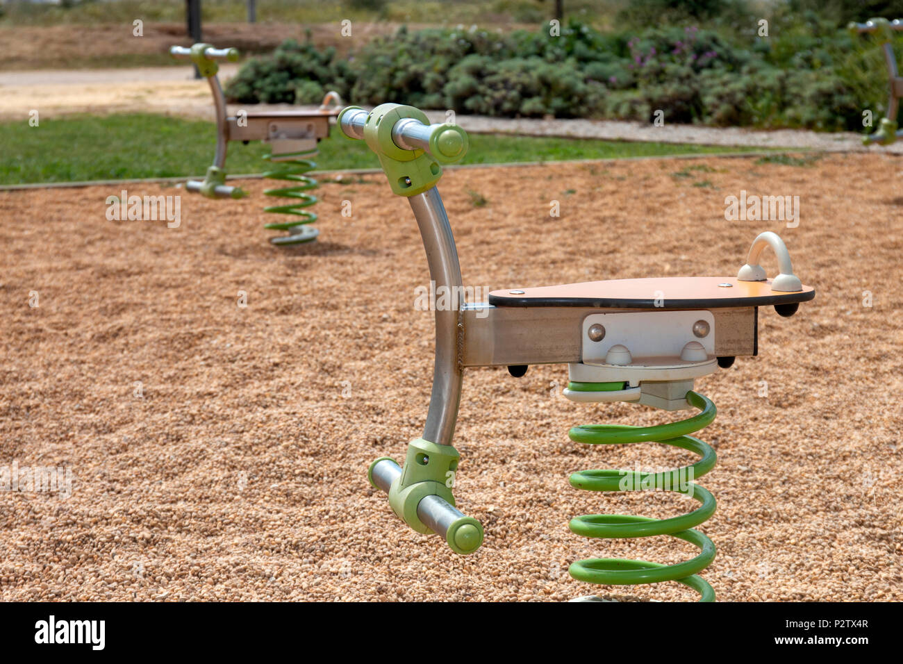 Close up view of a playground spring toy on a park Stock Photo - Alamy