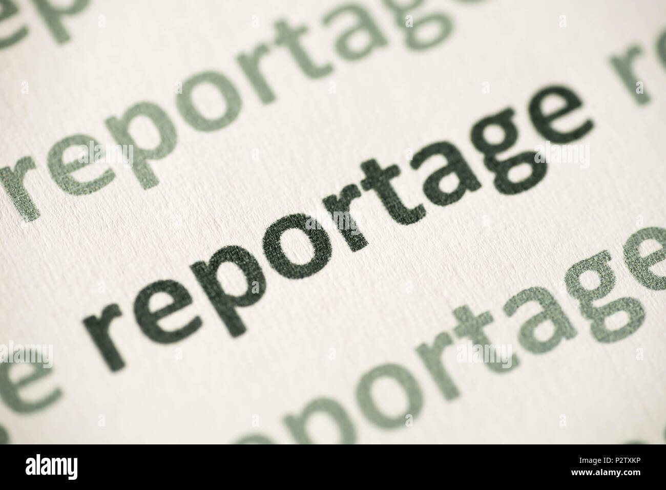 word reportage printed on white paper macro Stock Photo - Alamy