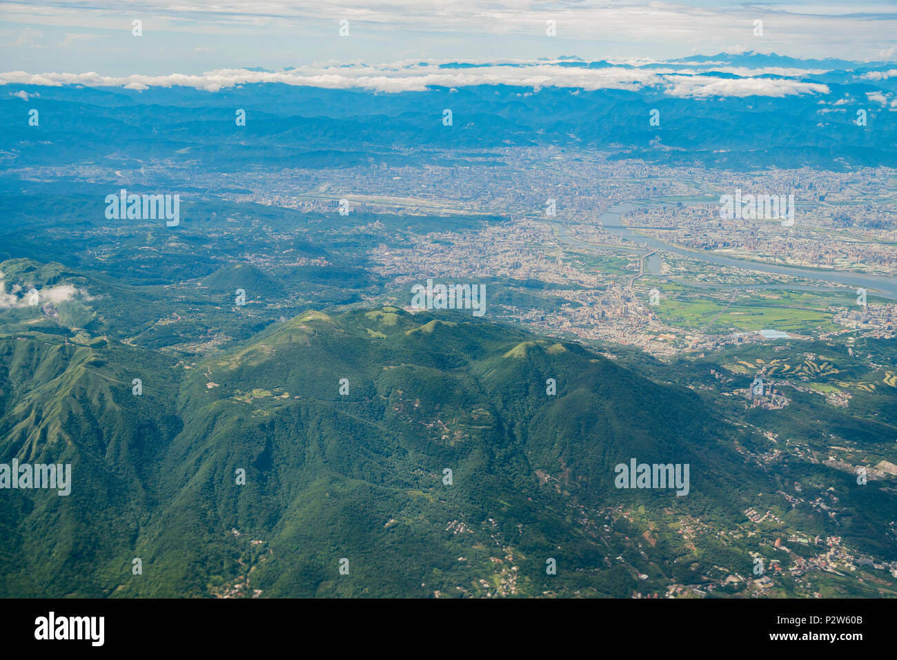 Aerial view of the beautiful Taipei City, from an airplane window seat ...