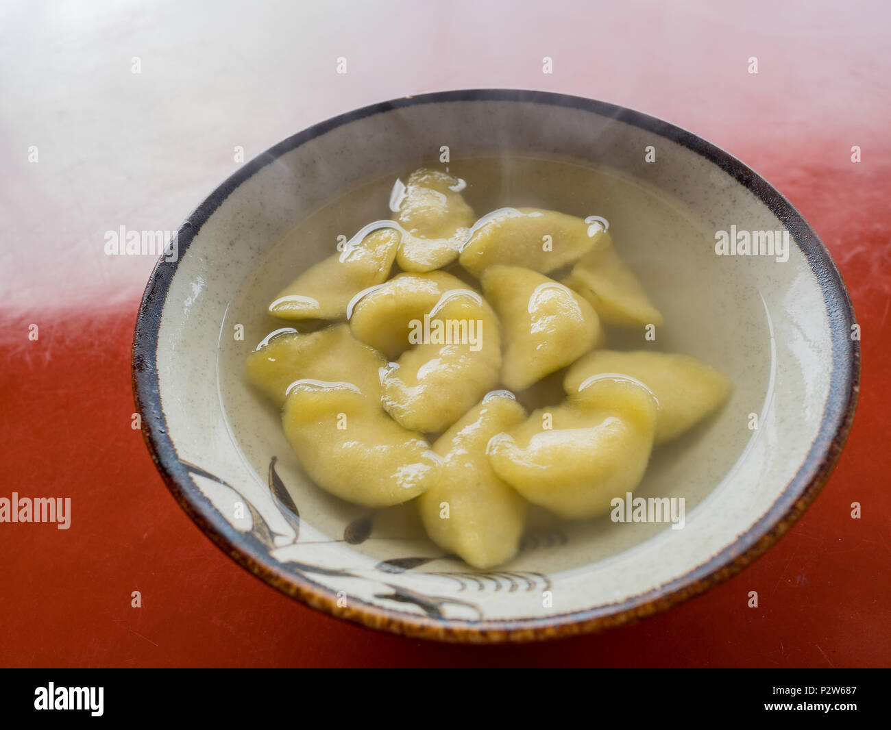 Close up shot of the traditional golden dumpling at Matsu Stock Photo ...