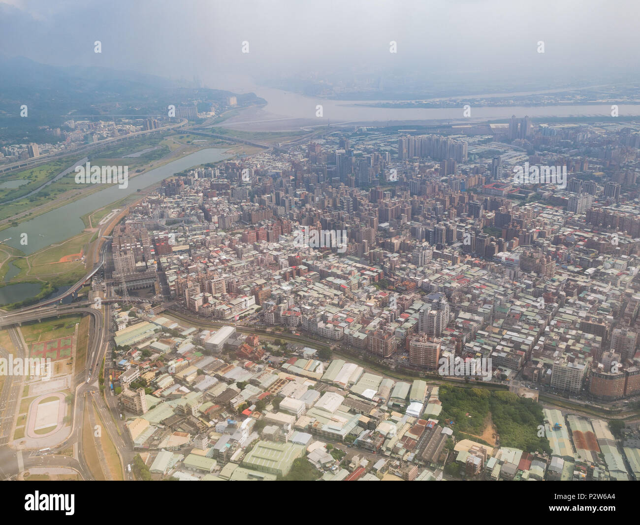Aerial view of the beautiful Taipei City, from an airplane window seat ...