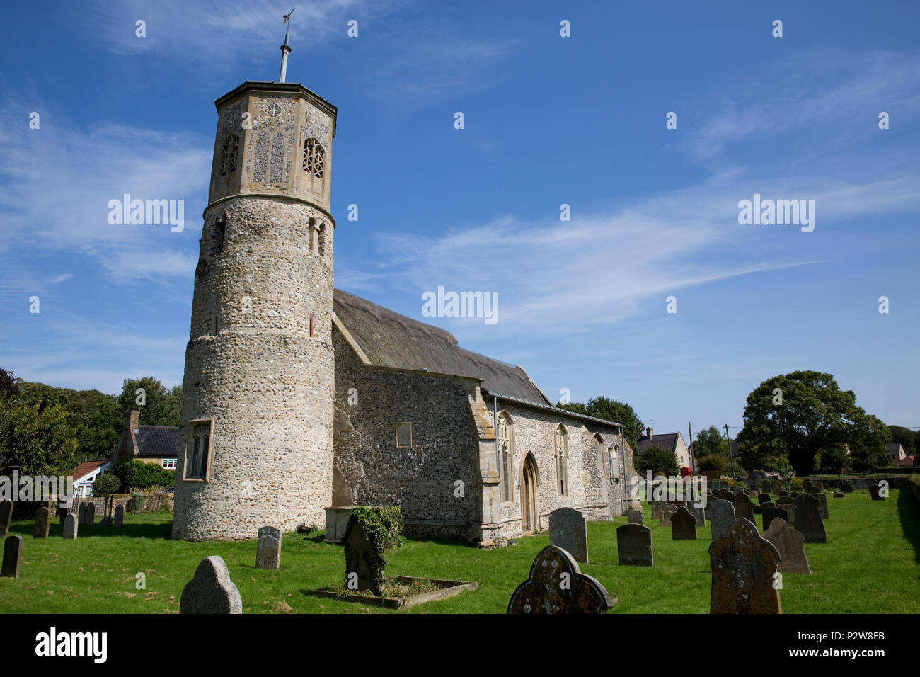 St Mary the Virgin Church, with its octagonal tower and thatched roof ...