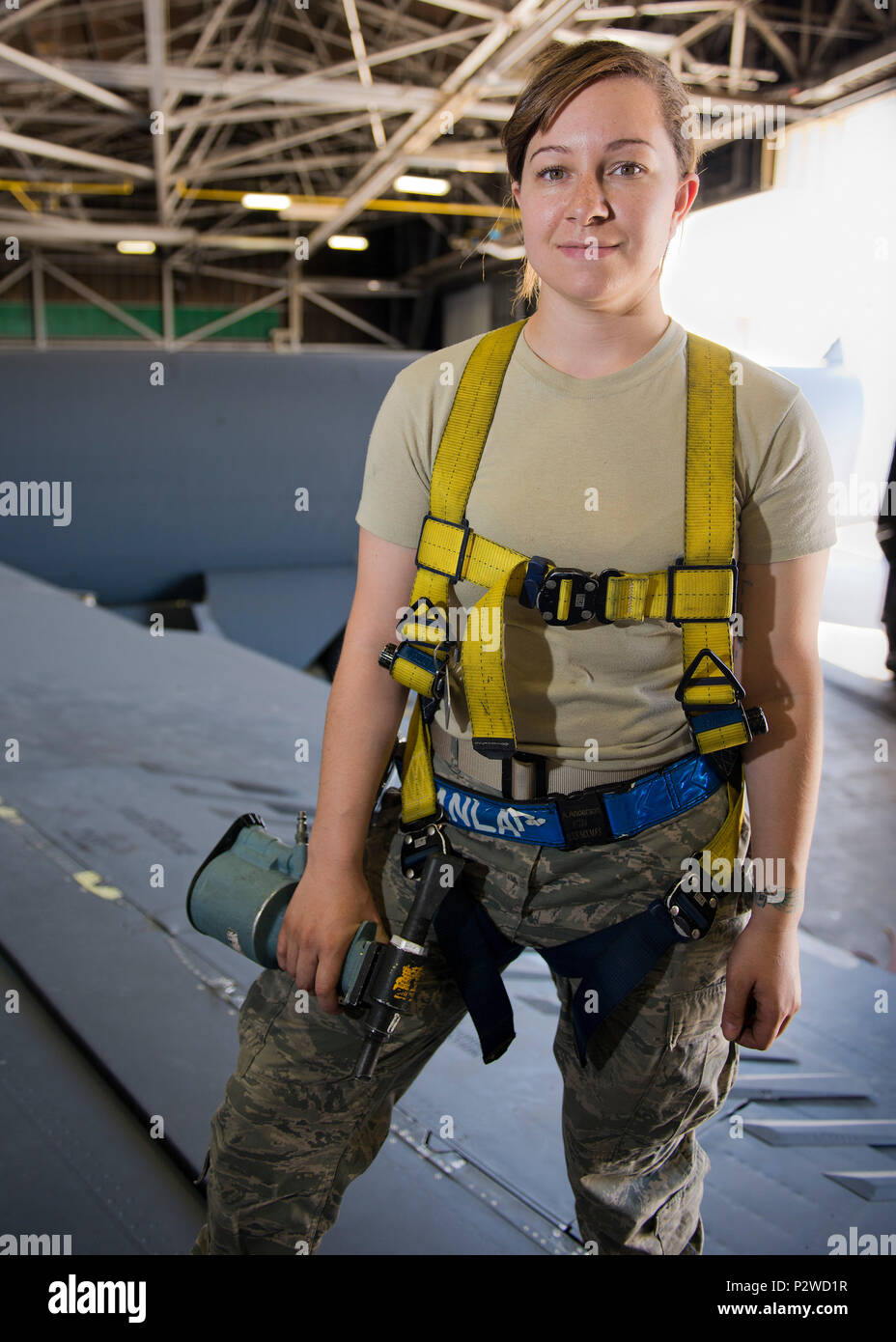 Senior Airman Amanda Scanlan, 5th Maintenance Squadron aircraft structural maintenance, stands ...