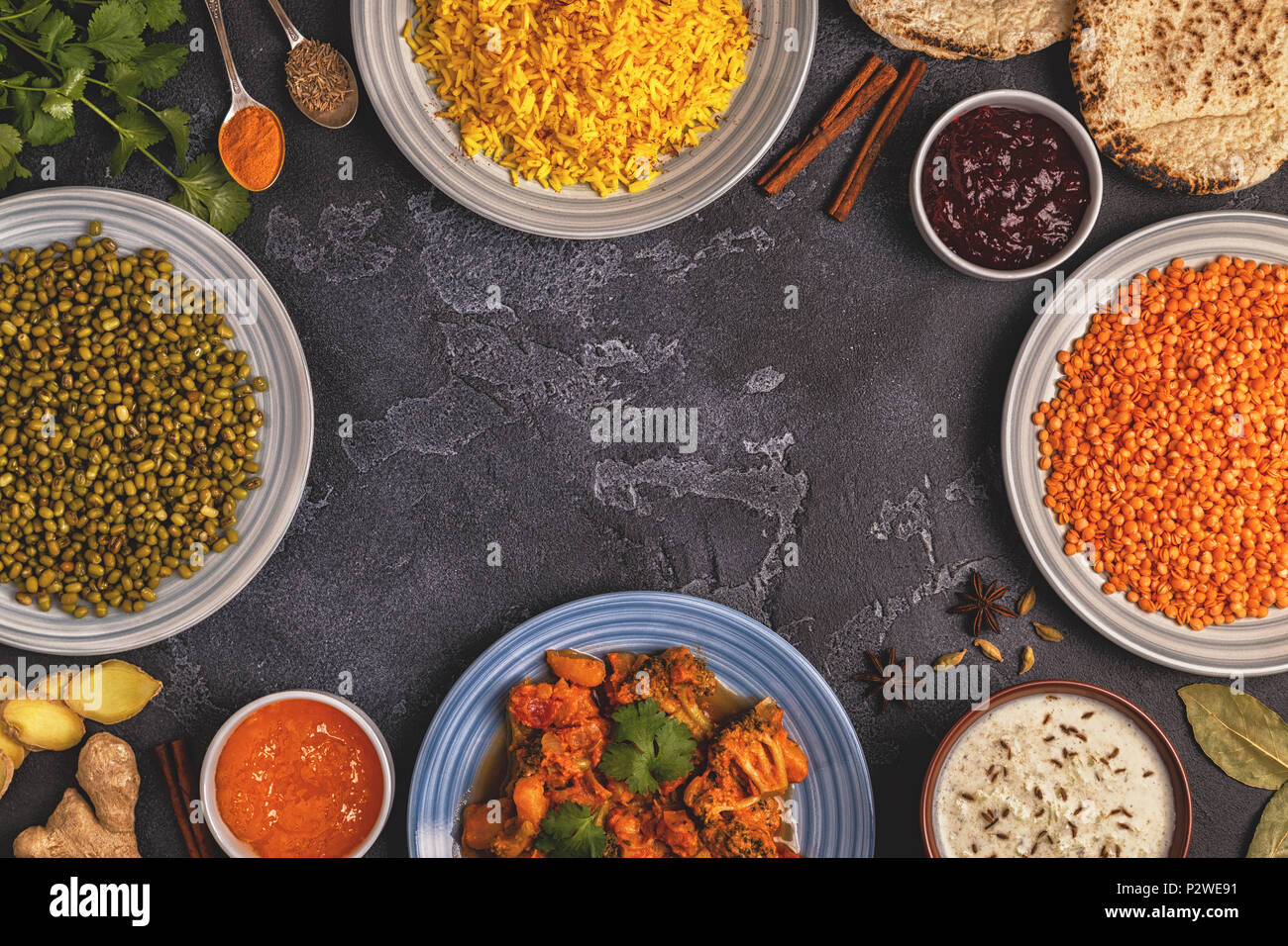 Traditional Indian curry with rice, lentils and mung beans. Top view ...