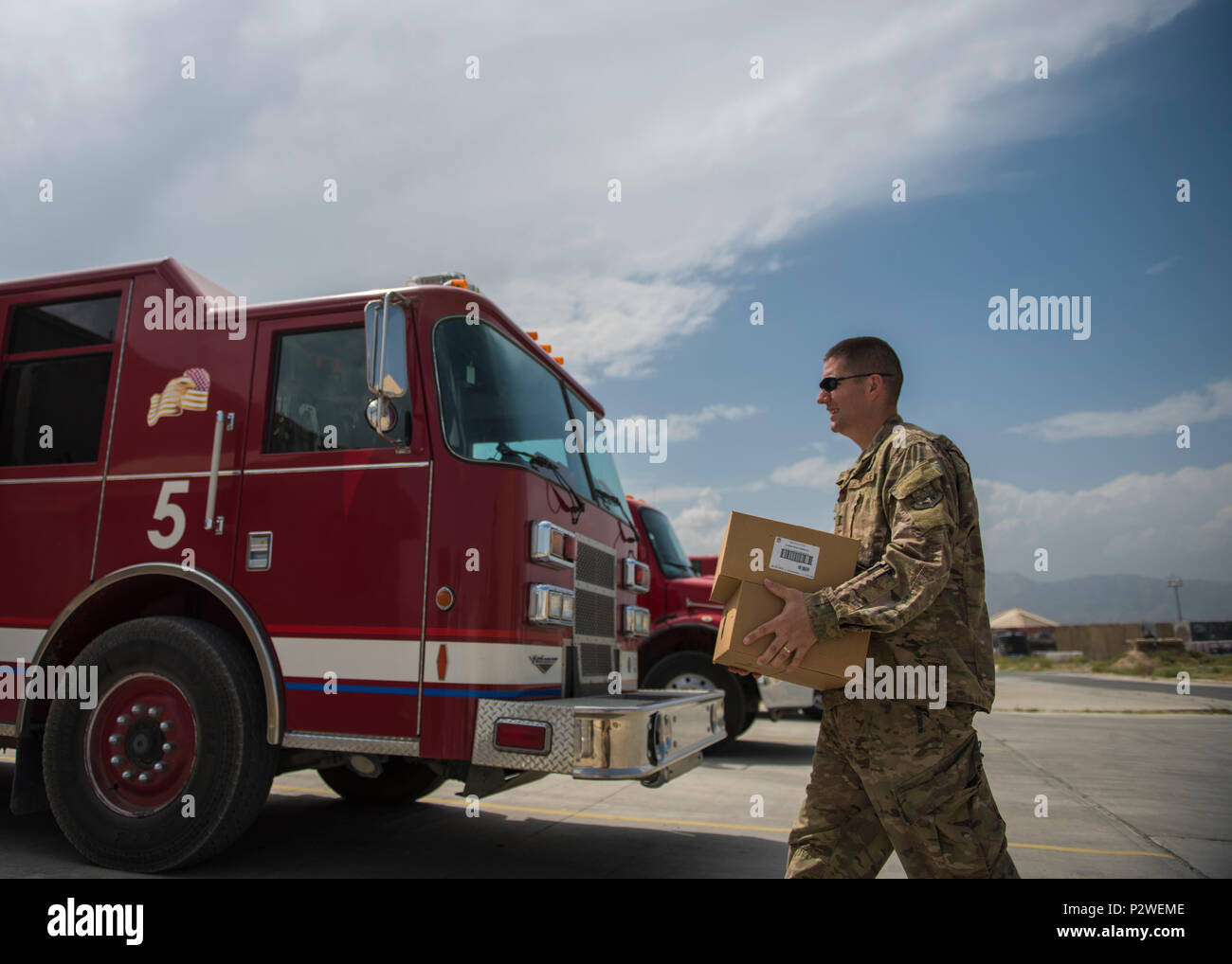 Capt. Jonathan Ayers, 455th Air Expeditionary Wing Chaplain, carries ...
