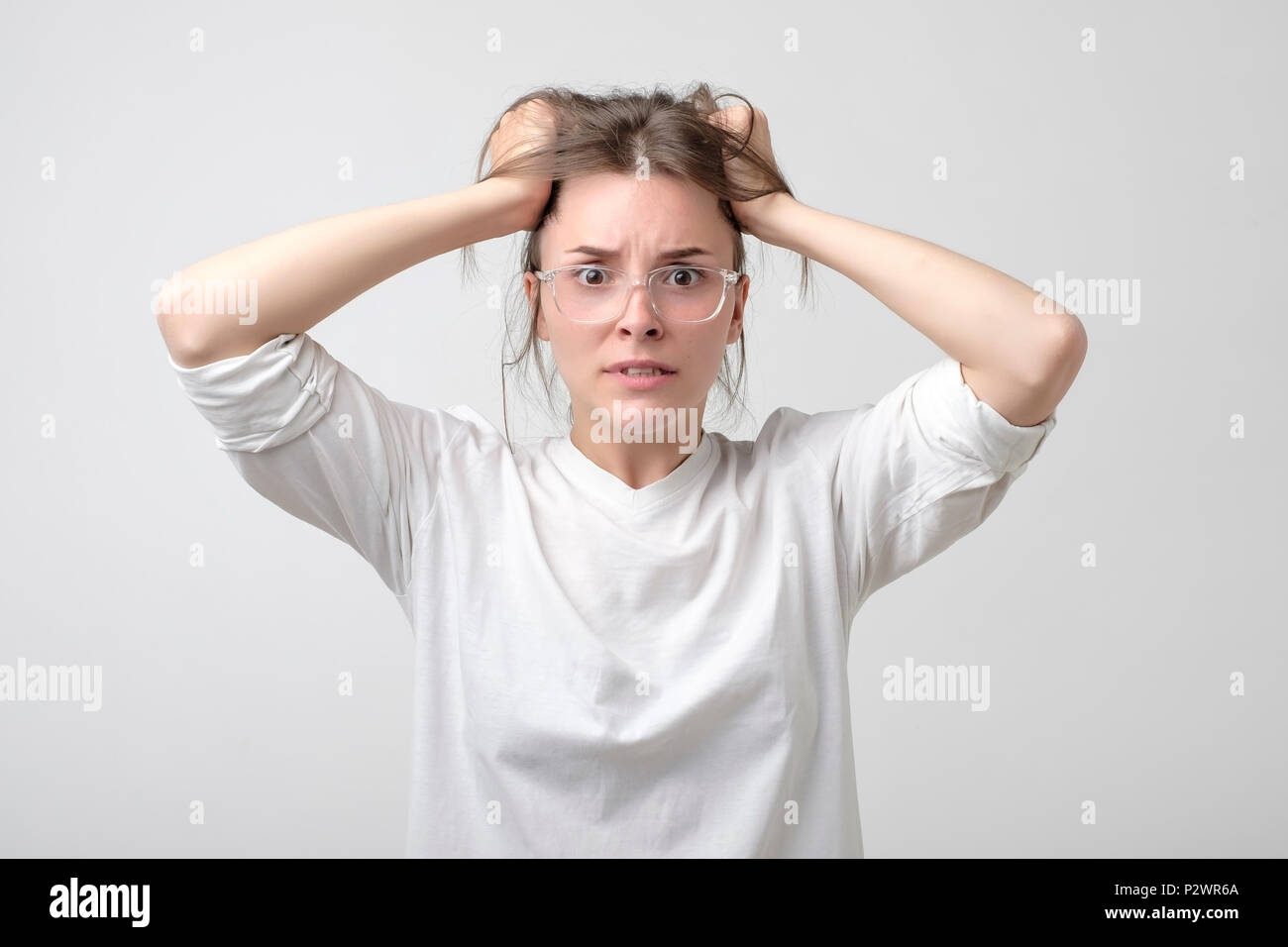 Woman head in hands embarrassed hi-res stock photography and images - Alamy