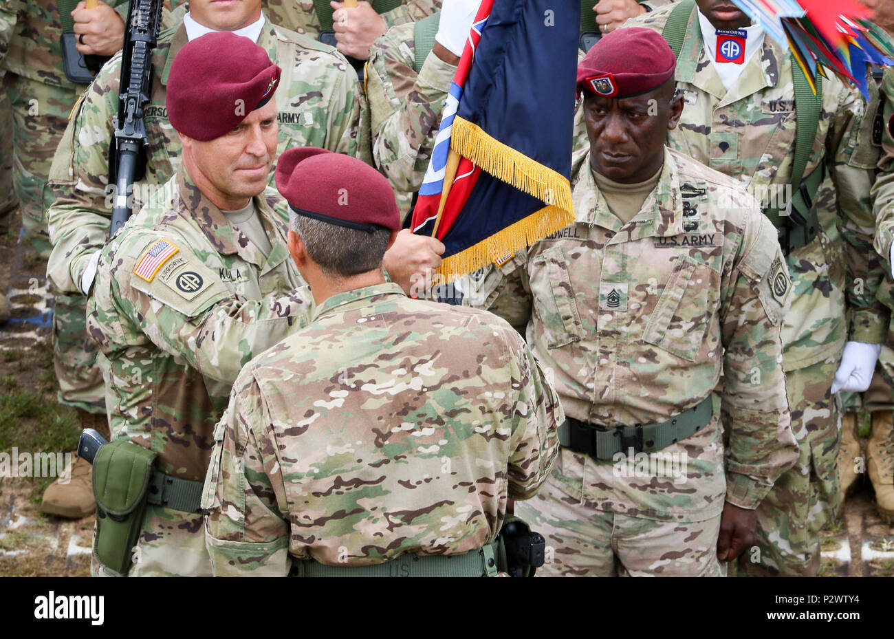 The XVIII Airborne Corps commander passes the unit guidon to the ...