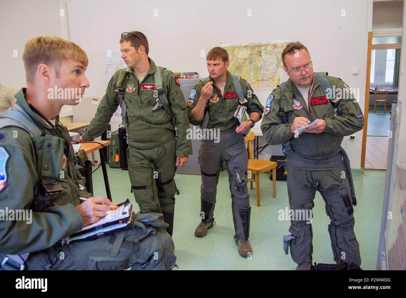 U.S. Lt. Col. Marc Garceau, Major James Edwards, Capt. Jamie Ligget and ...