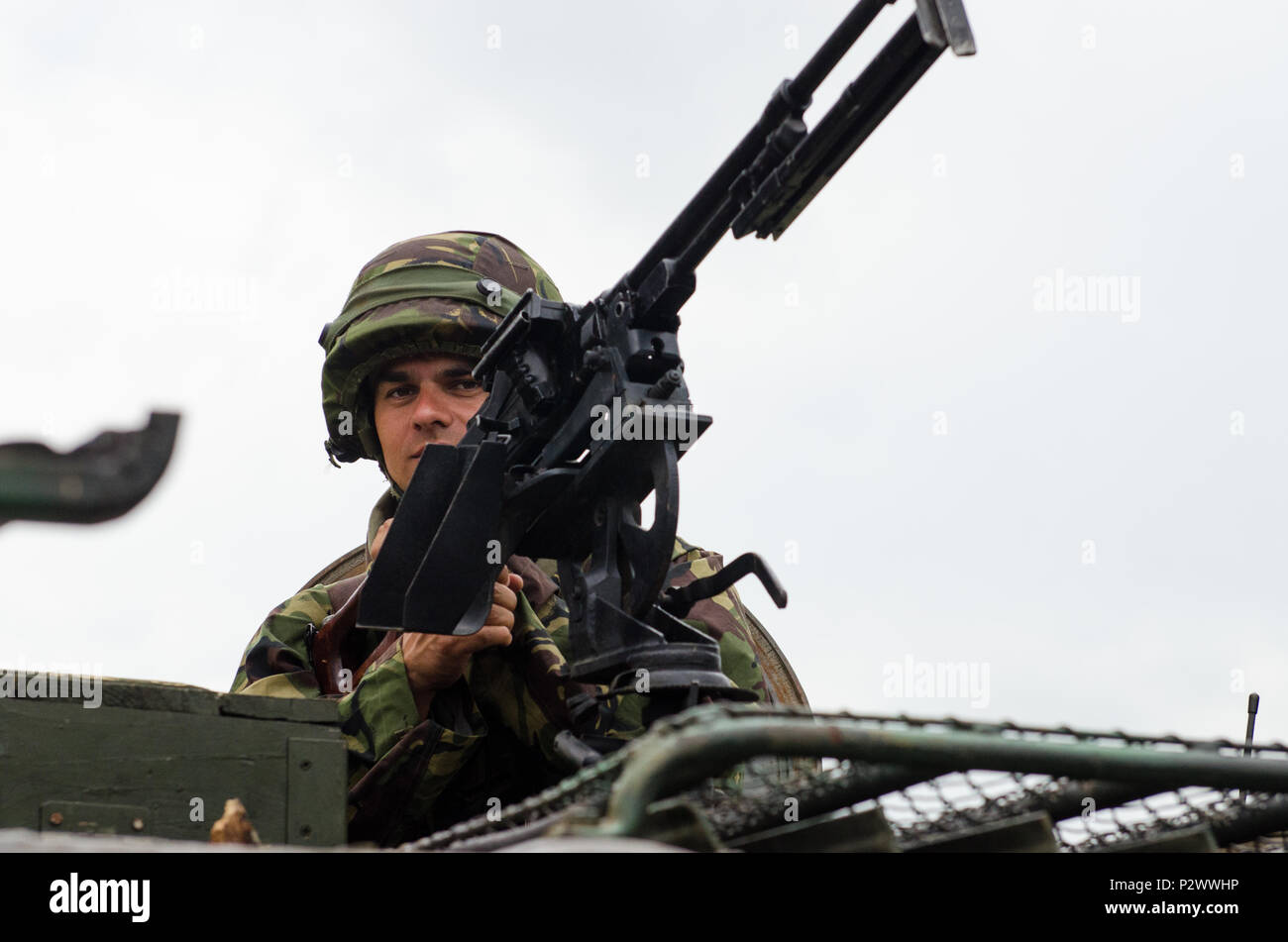 A Romanian Soldier with 191st Infantry Battalion stands in the turret ...