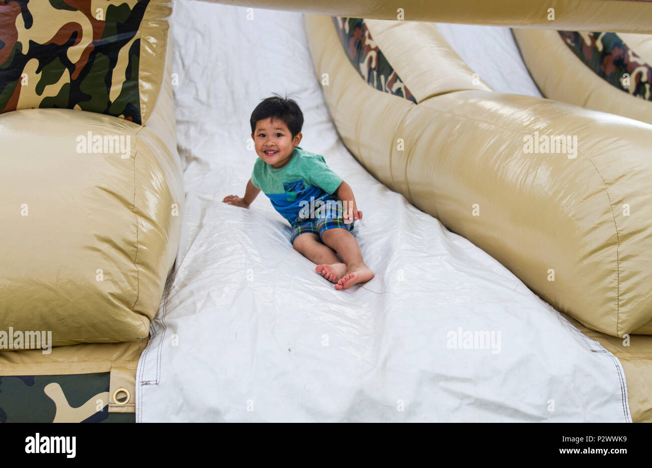 A child slides on an inflatable during the 33rd annual National Night ...