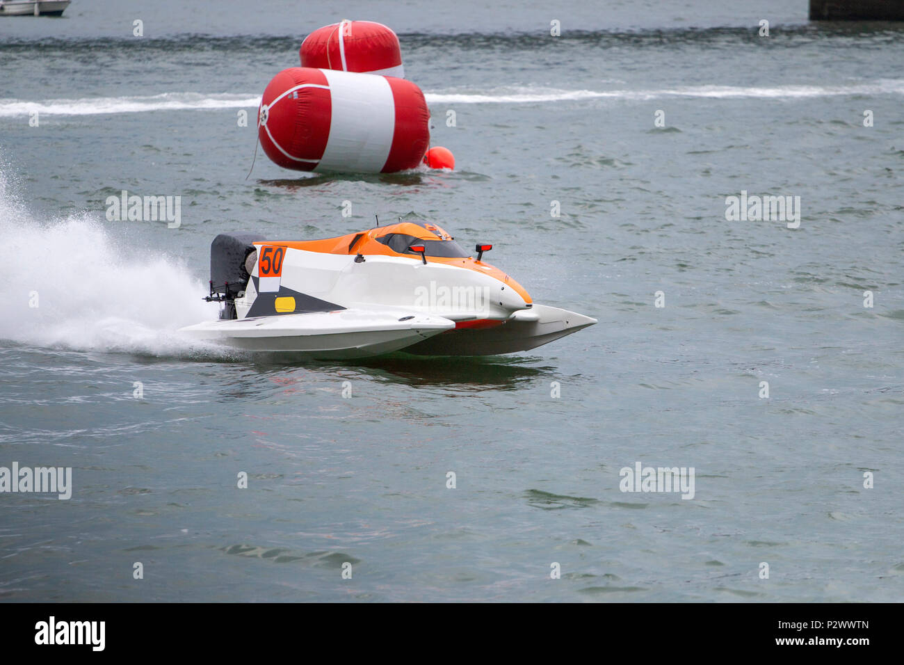 Fast powerboat racing on a river in Portimao, Portugal Stock Photo - Alamy