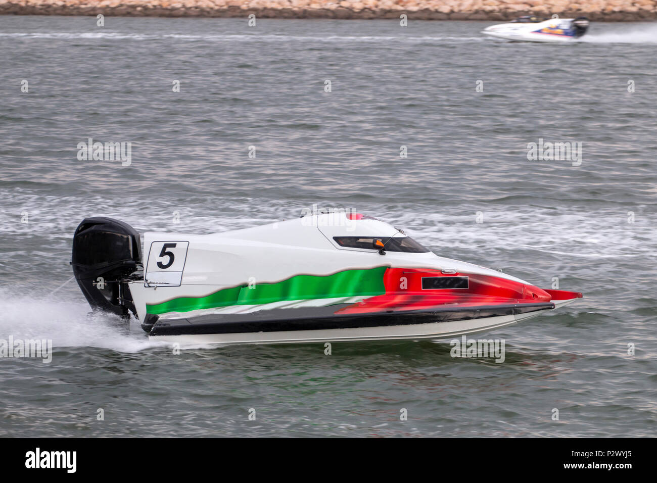 Fast powerboat racing on a river in Portimao, Portugal Stock Photo - Alamy