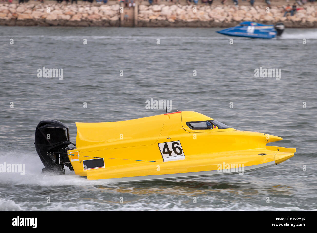 Fast powerboat racing on a river in Portimao, Portugal Stock Photo - Alamy