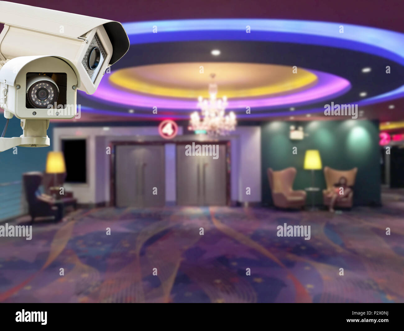 The CCTV Security Camera operating in seat for cinema blur background ...