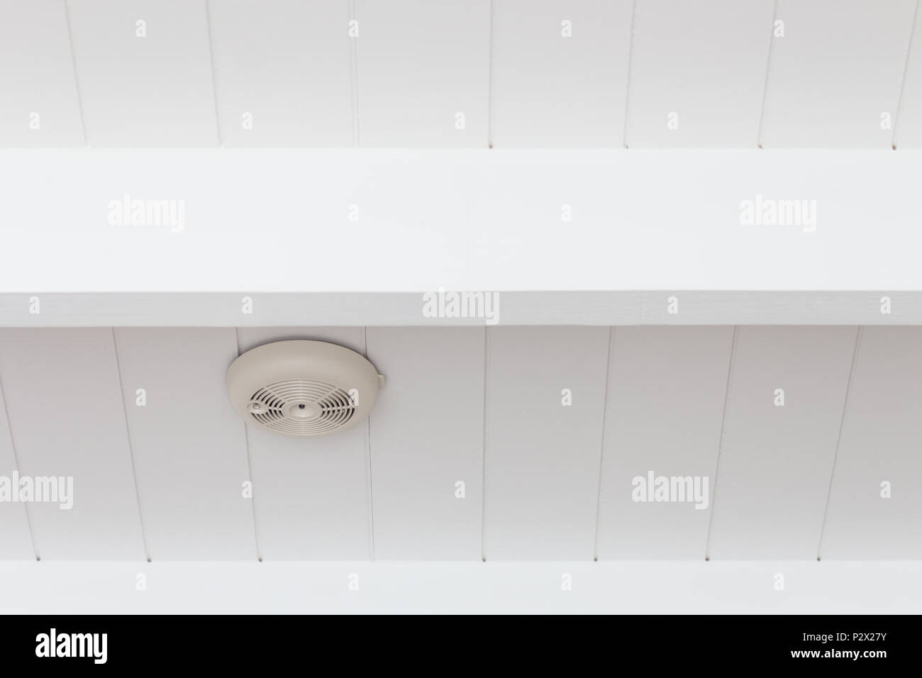 Smoke detector of fire alarm on white wooden ceiling Stock Photo - Alamy