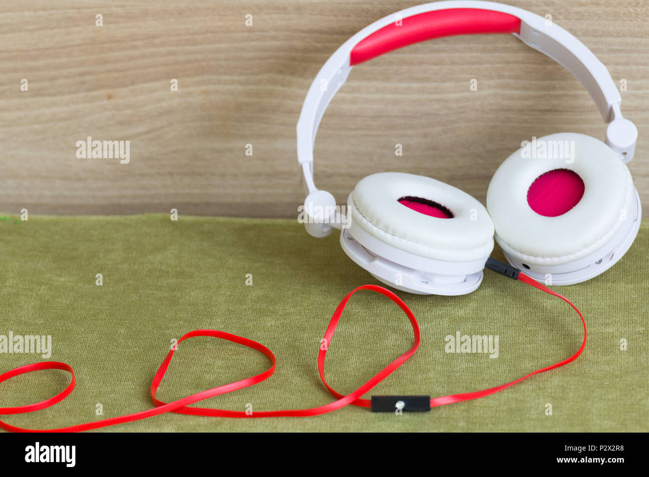A big white and red headphones with modern background Stock Photo - Alamy