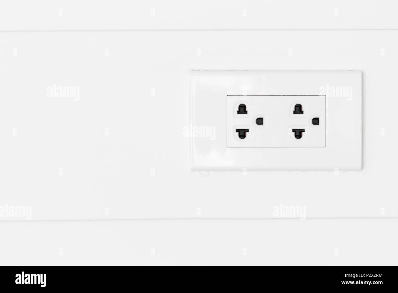 White plugs on white wood wall, plug copy space, plug socket, plug ...