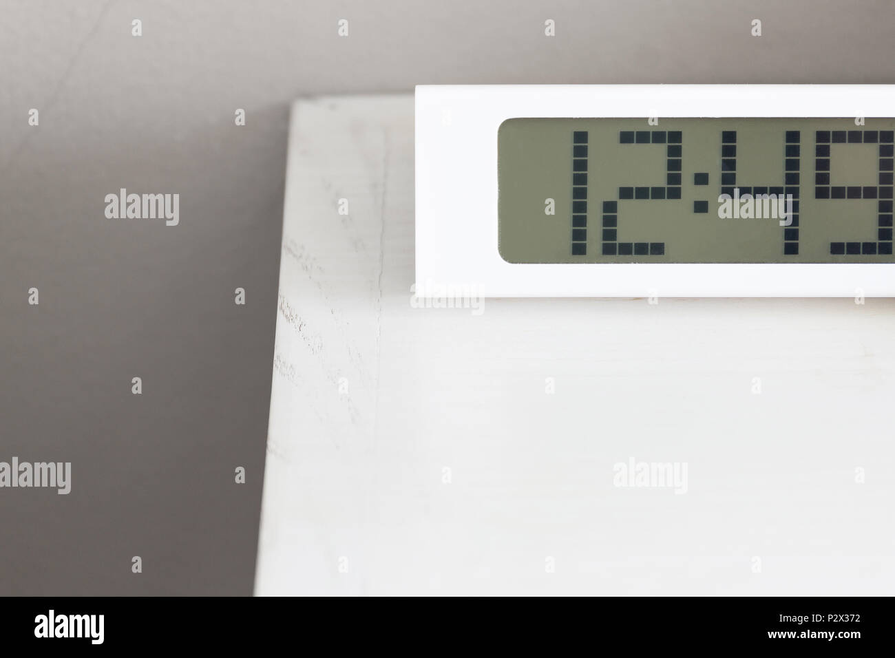 White clock digital modern on white table in bedroom Stock Photo - Alamy