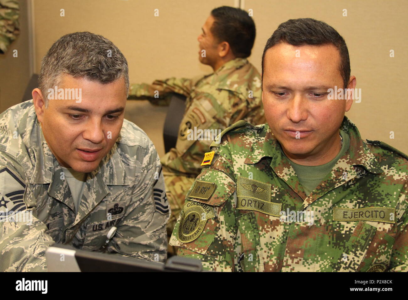 U.S. Air Force Master Sgt. William Arcila and Colombian army Lt. Col. Oscar Ortiz collaborate ...