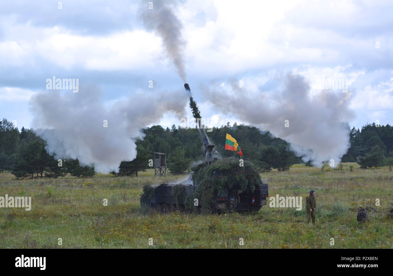 A Lithuanian PzH2000 self-propelled howitzer fires a round as part of a coastal defense ...