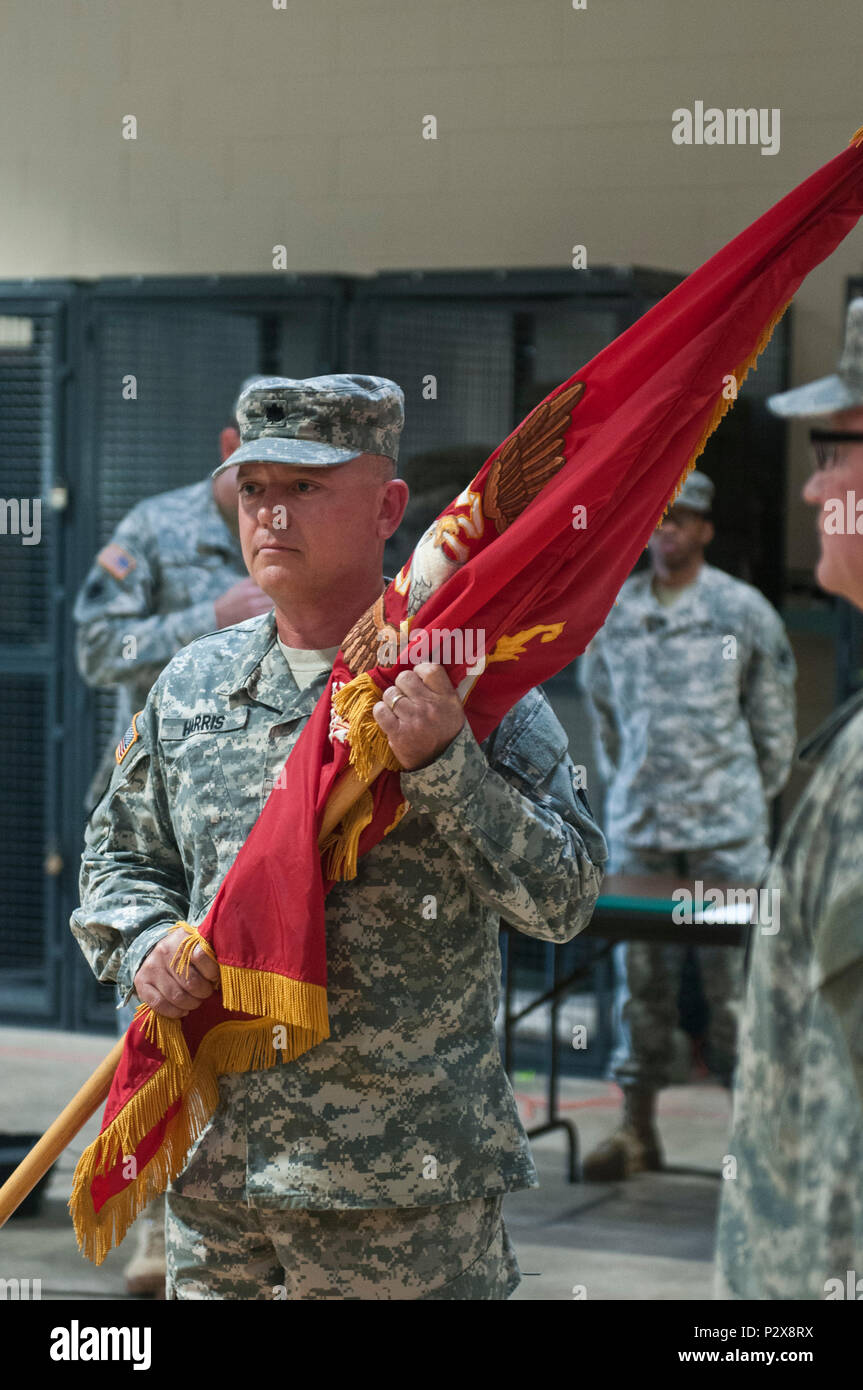 Lt. Col. Paul Harris of Edmond, Oklahoma, holds the colors of the 1st ...