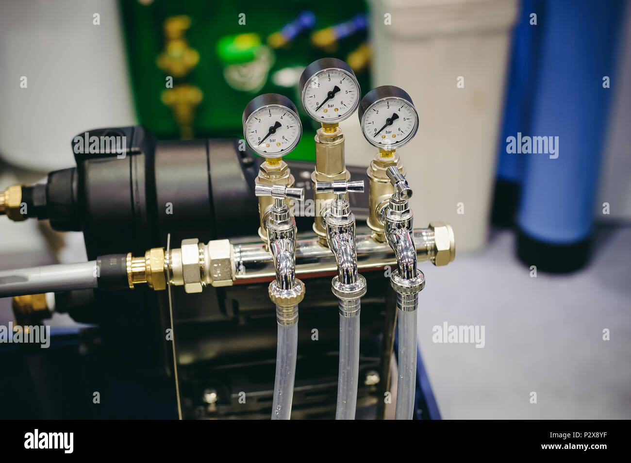 Thermometer, pipes and faucet valves of heating system in a boiler room ...