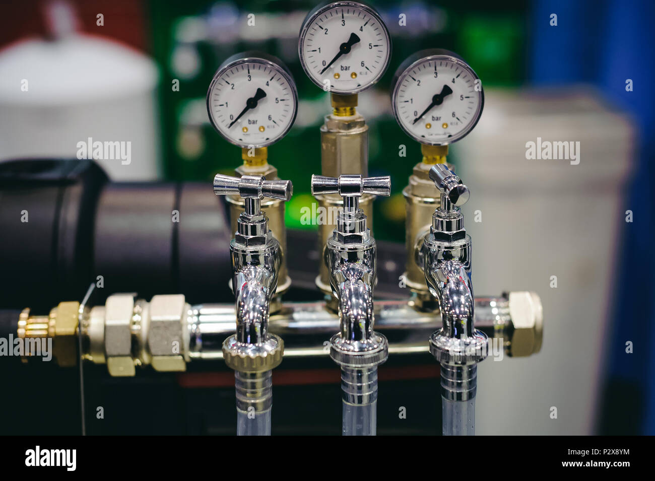 Thermometer, pipes and faucet valves of heating system in a boiler room ...