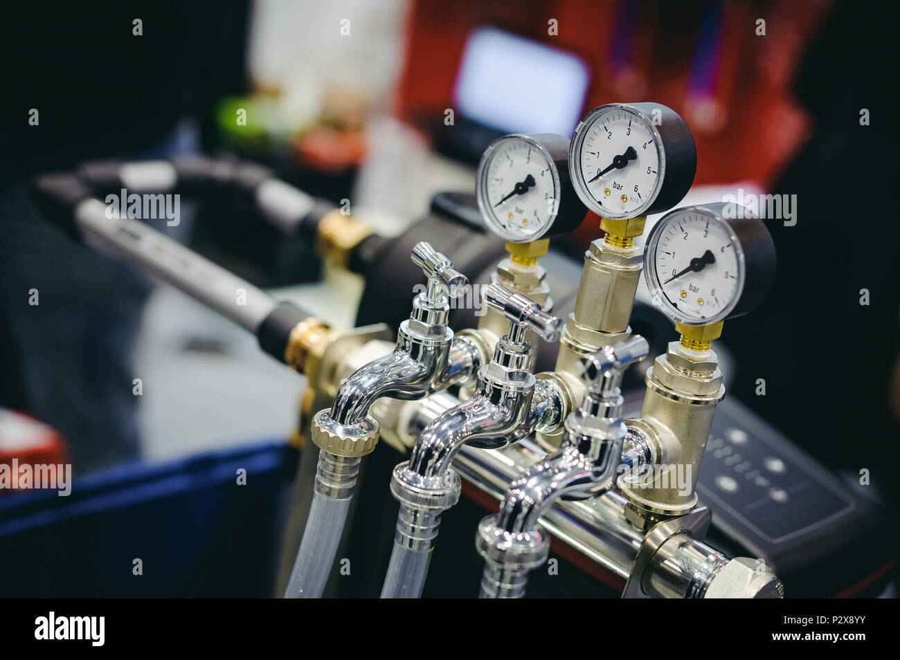 Thermometer, pipes and faucet valves of heating system in a boiler room ...