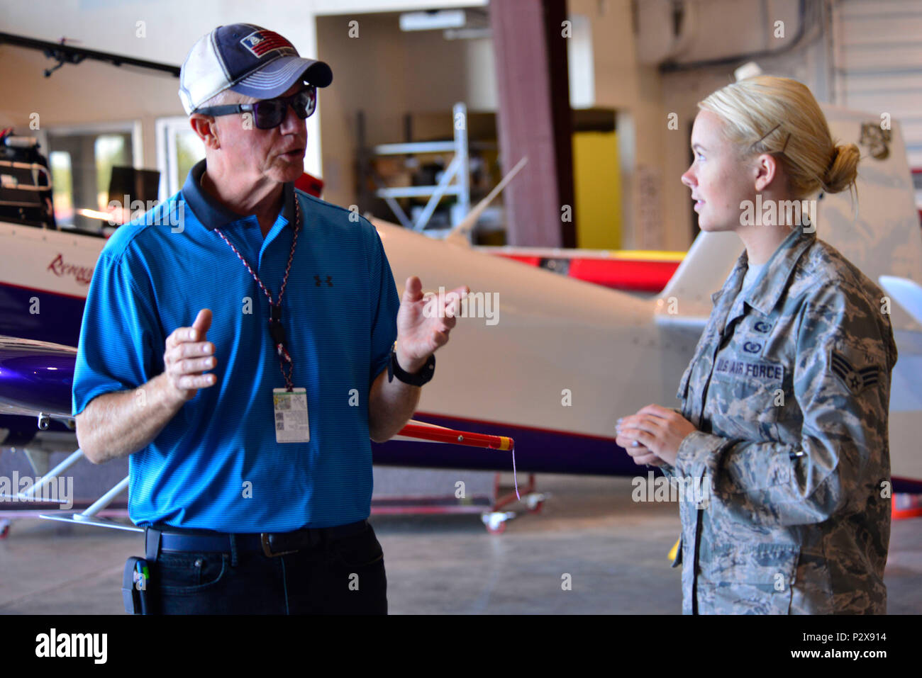 Aerobatic pilot Renny Price briefs Senior Airman Brittani Morelli, a ...