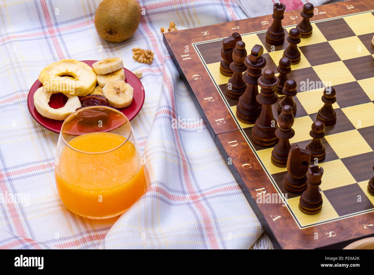 Healthy eating concept. Mix of dried fruits and nuts with chess pieces ...