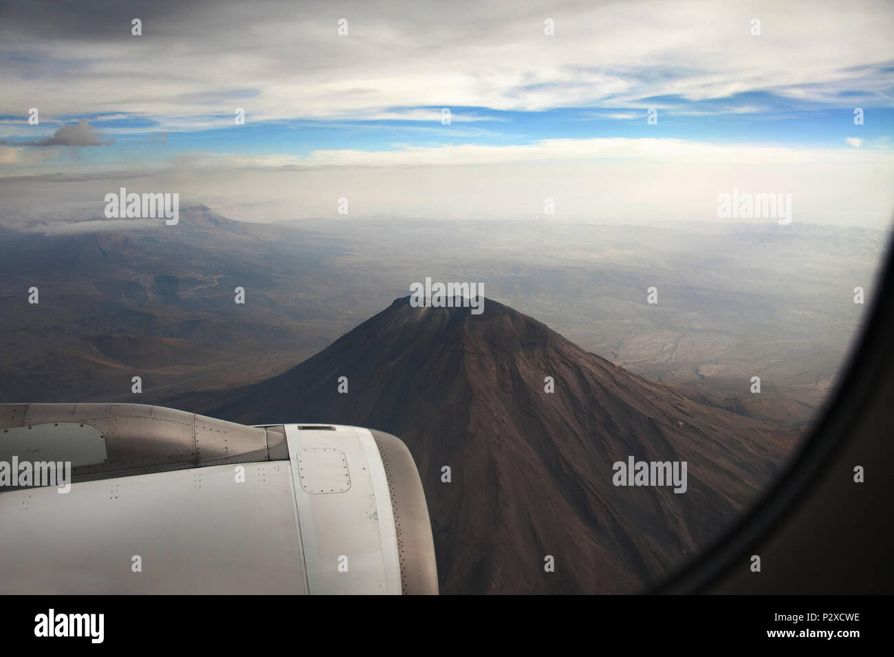 Passengers view of a volcano from an aircraft window Stock Photo - Alamy