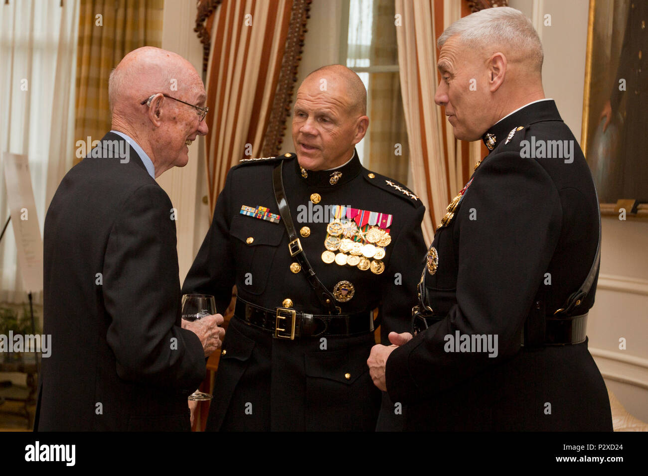 Commandant of the Marine Corps Gen. Robert B. Neller, center, speaks to ...