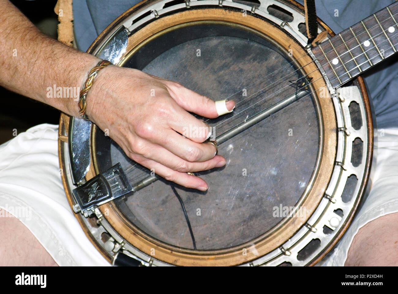 A banjo player plays a banjo at a family reunion Stock Photo - Alamy