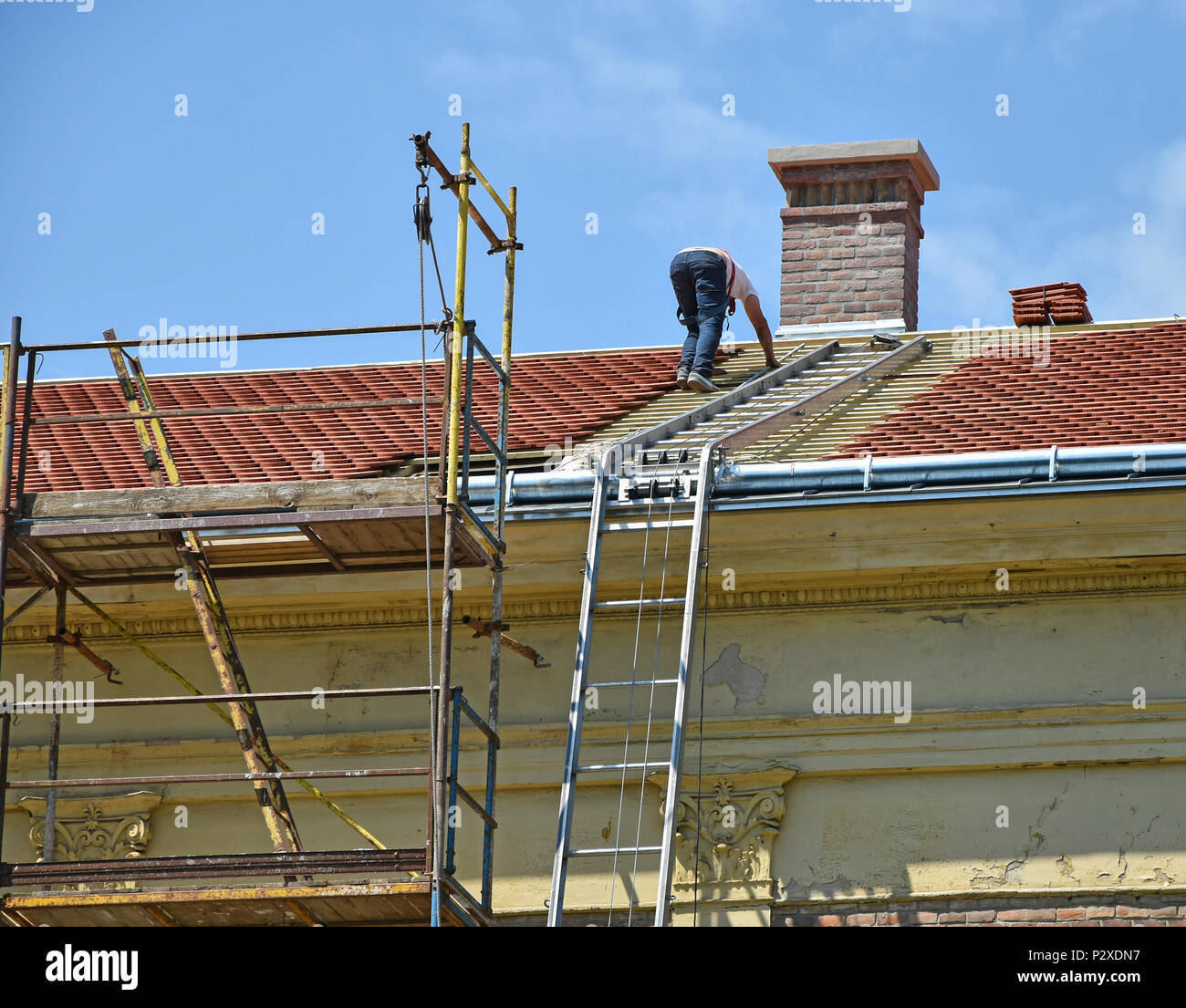 Roofer on a ladder hi-res stock photography and images - Alamy